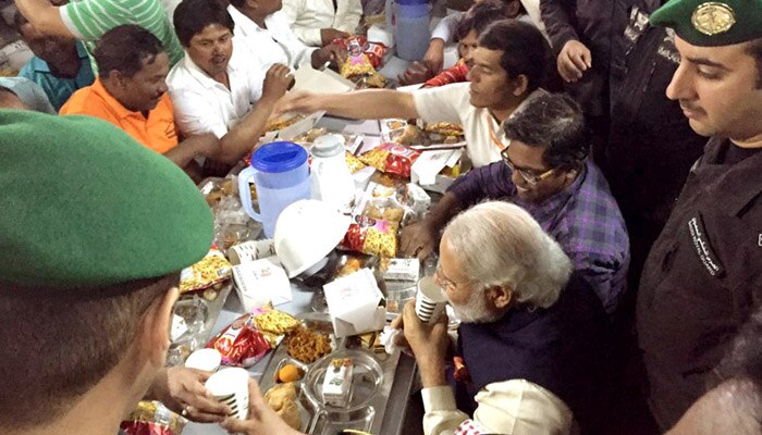 PM Narendra Modi breaks bread with Indian construction workers in Saudi ...