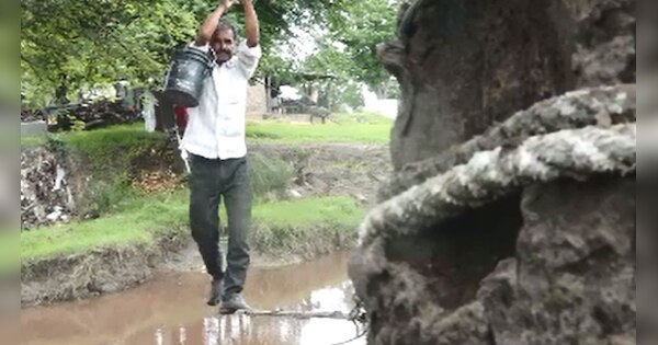 ratlam people crossing drain with rope in heavy rain flood in madhya ...