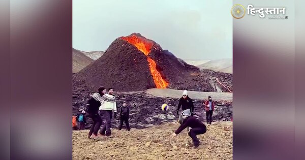 Viral Video of people playing volleyball in front of erupting volcano ...