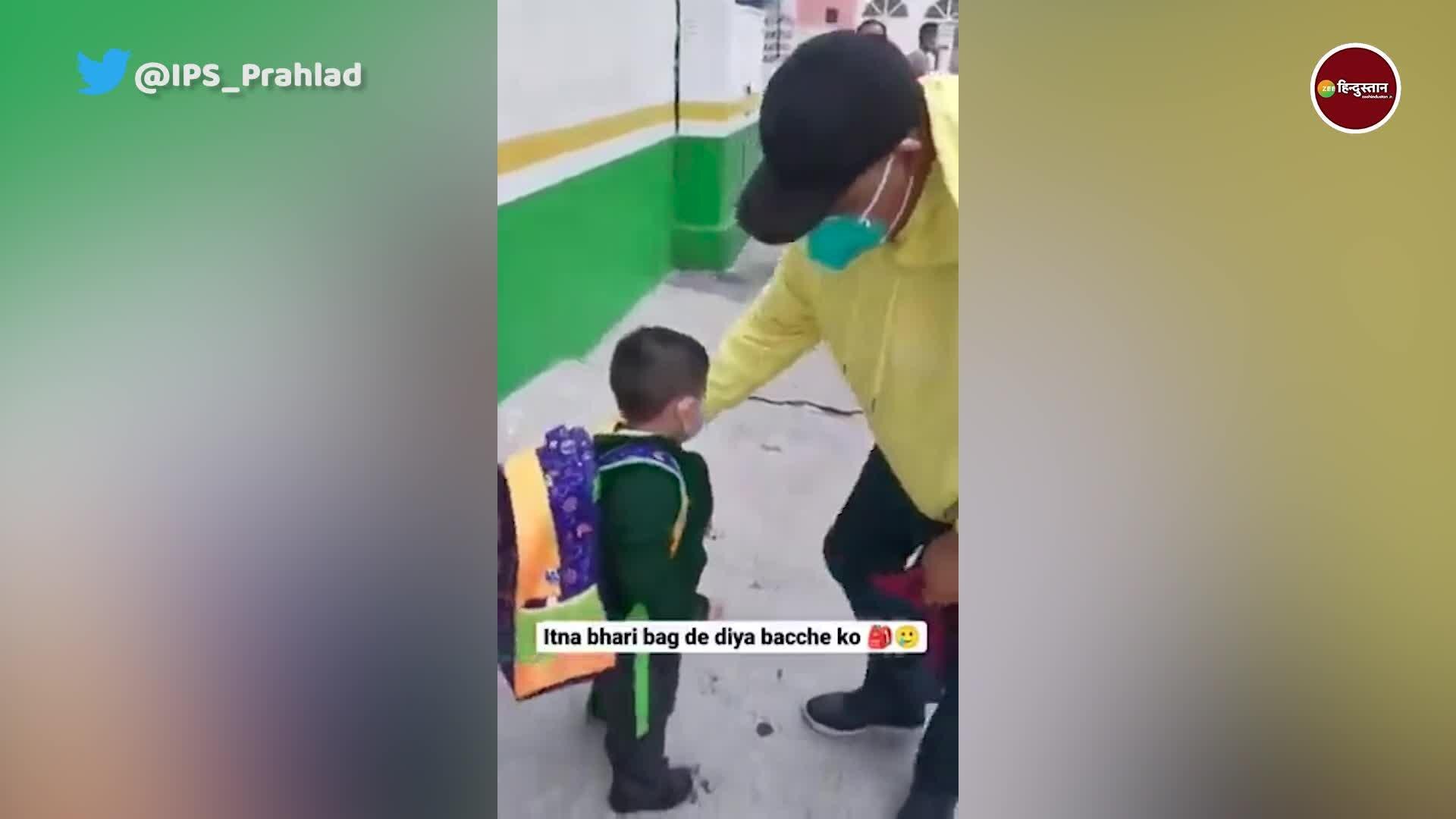 school boy carring a heavy bag falls down video shows pressure on ...