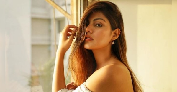 Rhea Chakraborty super bold photoshoot in black thigh high slit skin ...
