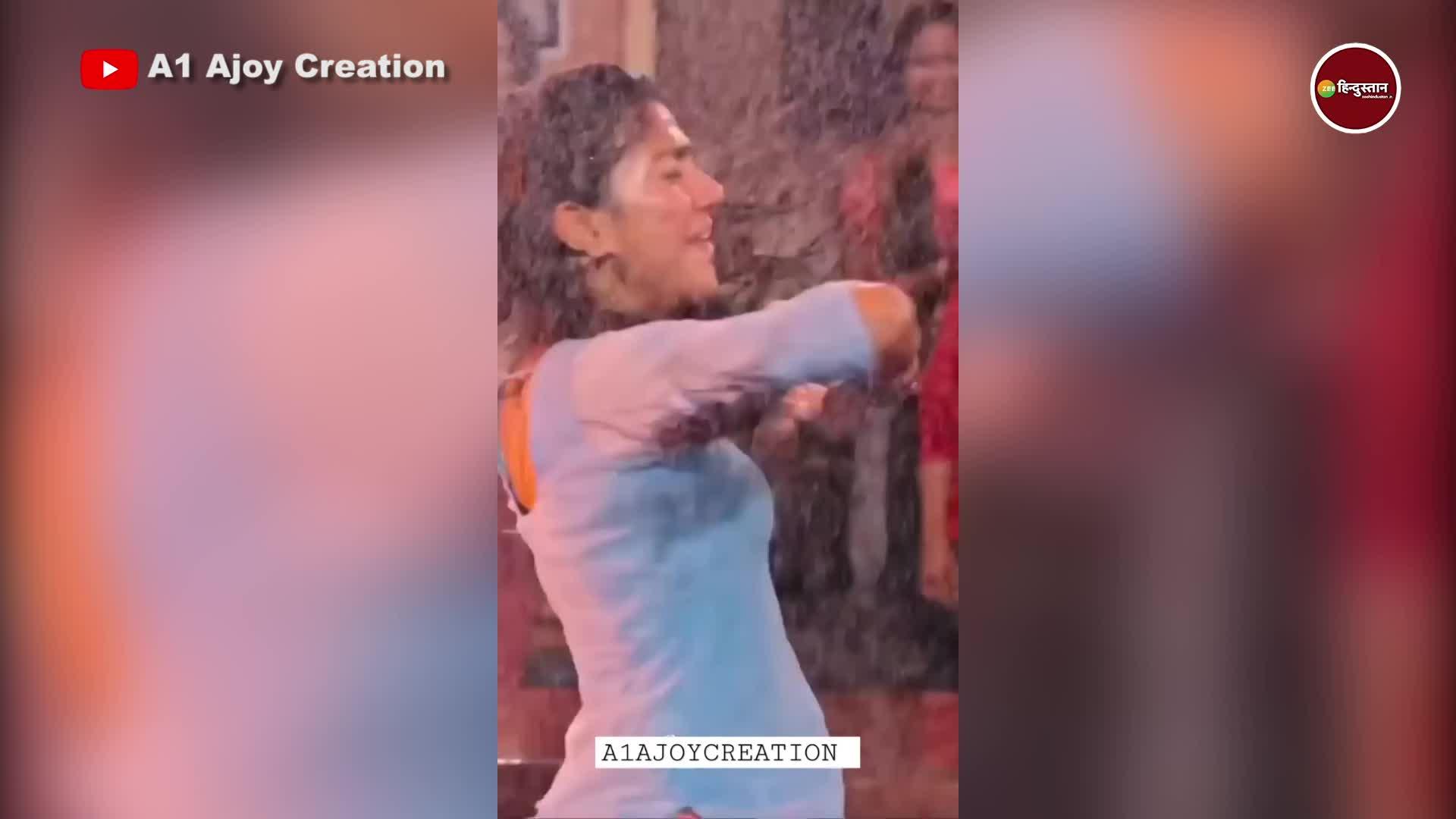 rain dance desi girl is flexing her waist social media has gone up | भीगे बदन में देसी लड़की यूं ...