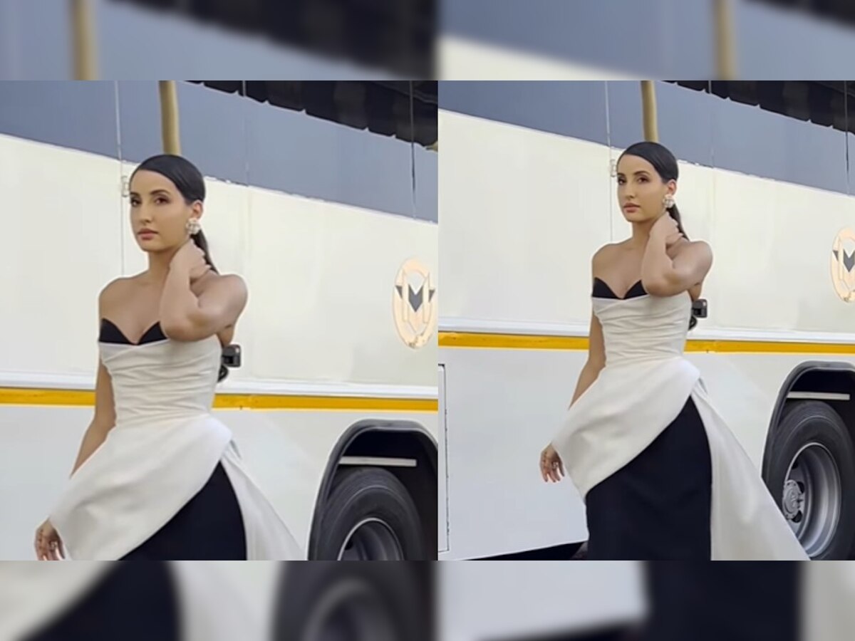 hotness queen Nora Fatehi wear off shoulder deep neck black and white gown looking hot mkph ...