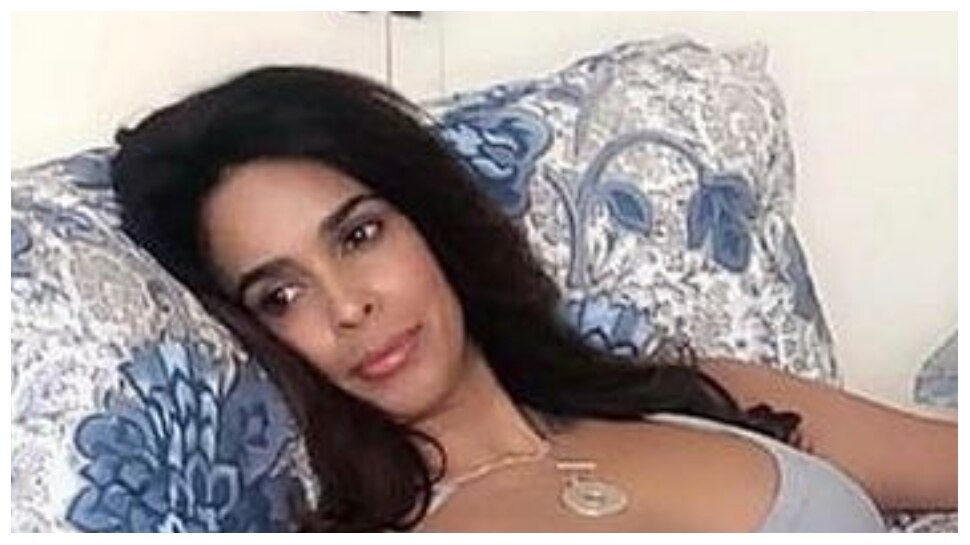Mallika Sherawat sizzle at the age of 46 look super sexy on the couch look wear bra and pantie ...