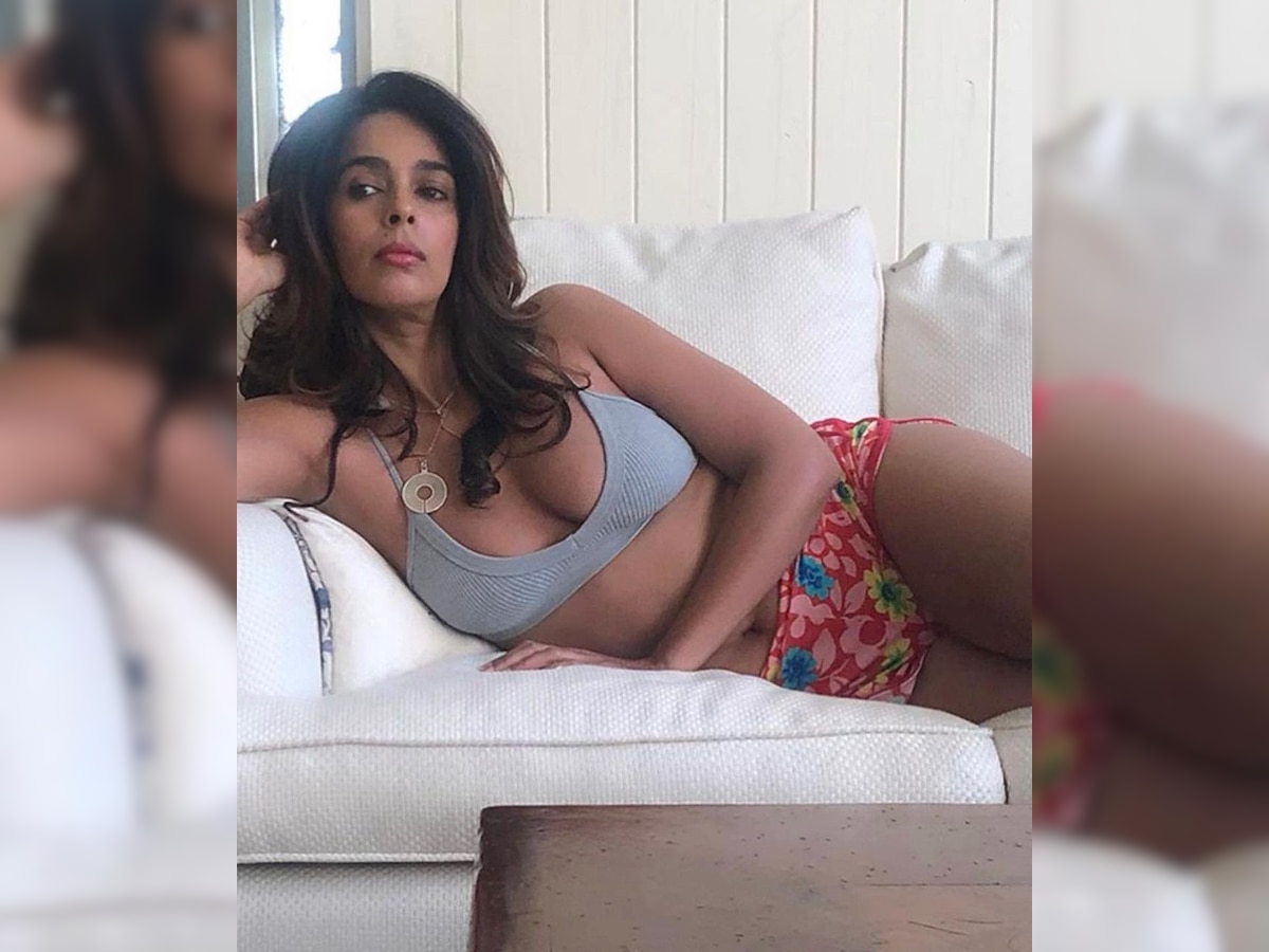 Mallika Sherawat sizzle at the age of 46 look super sexy on the couch look wear bra and pantie ...