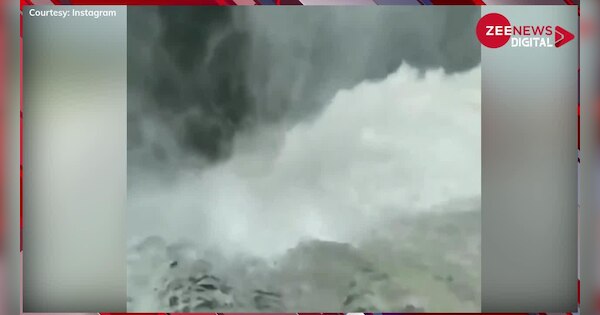 girl leans over the edge of victoria falls one of the worlds largest ...