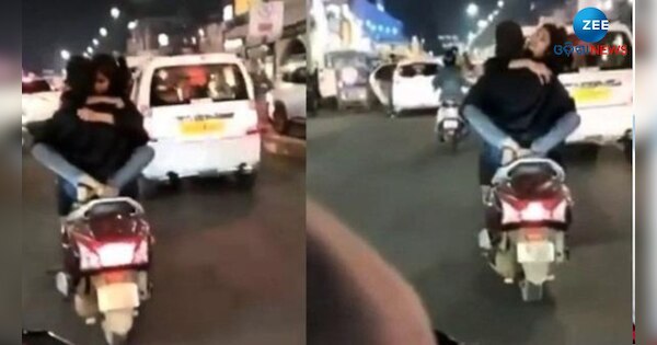 lucknow road romance viral video girl hug kiss boy on scooty man arrested police files case