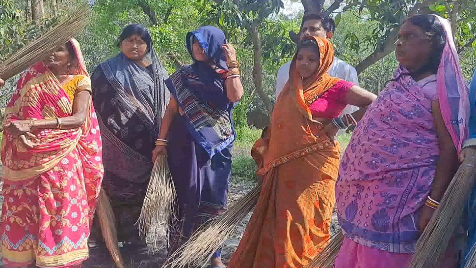 Women searching for smack addicts with brooms in their hands know why ...