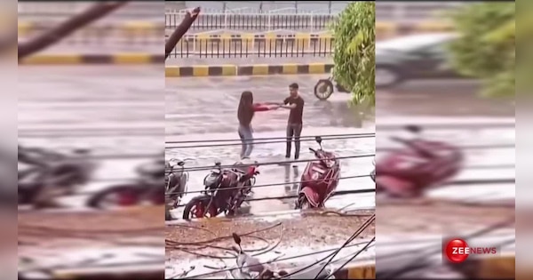 boy girl romantic dance on busy street in rain internet divided few praises them few got jealous ...
