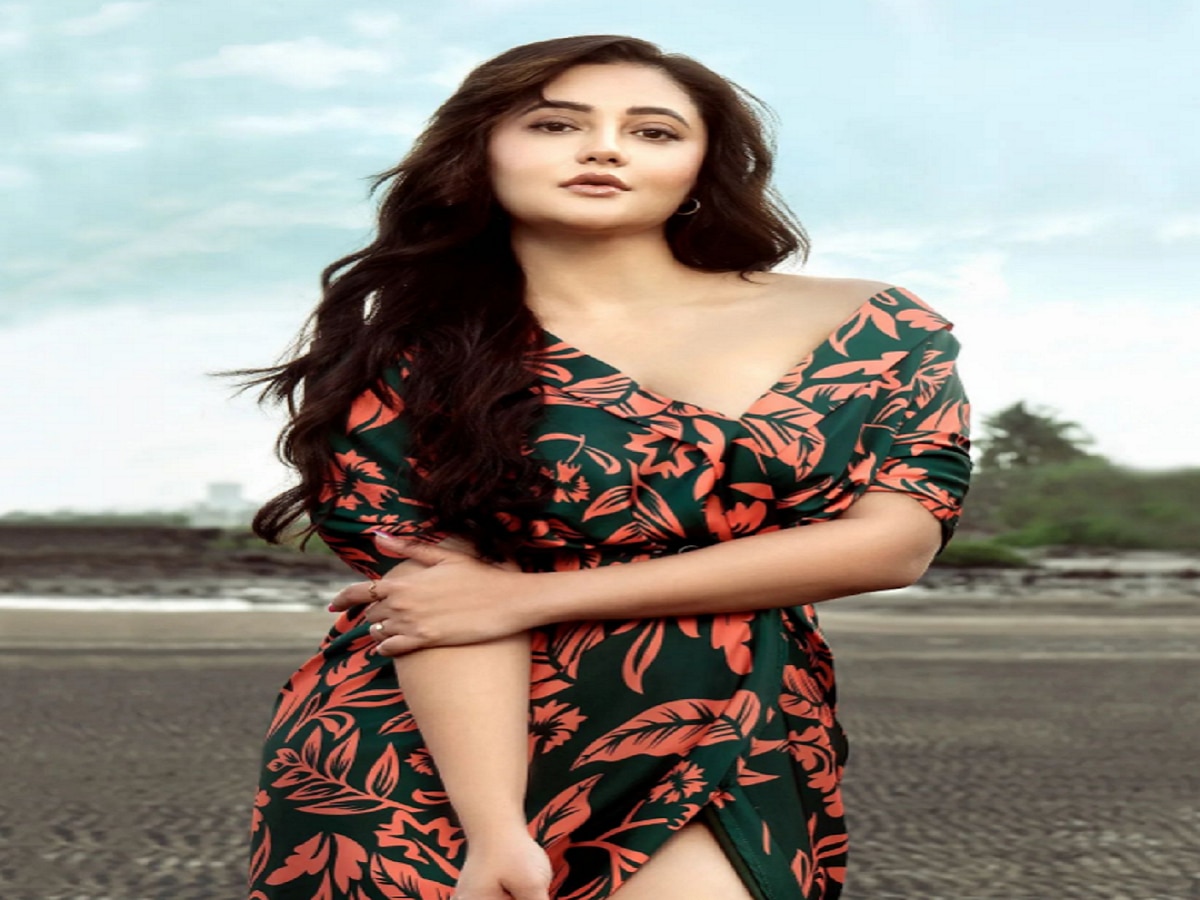 Rashmi desai bold photoshoot wearing deep neck top with brown pant ...