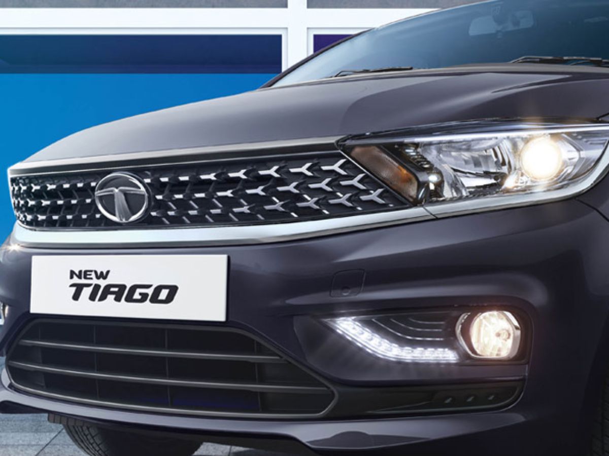 tata tiago twin cylinder on road price cng boot space rivals of maruti ...