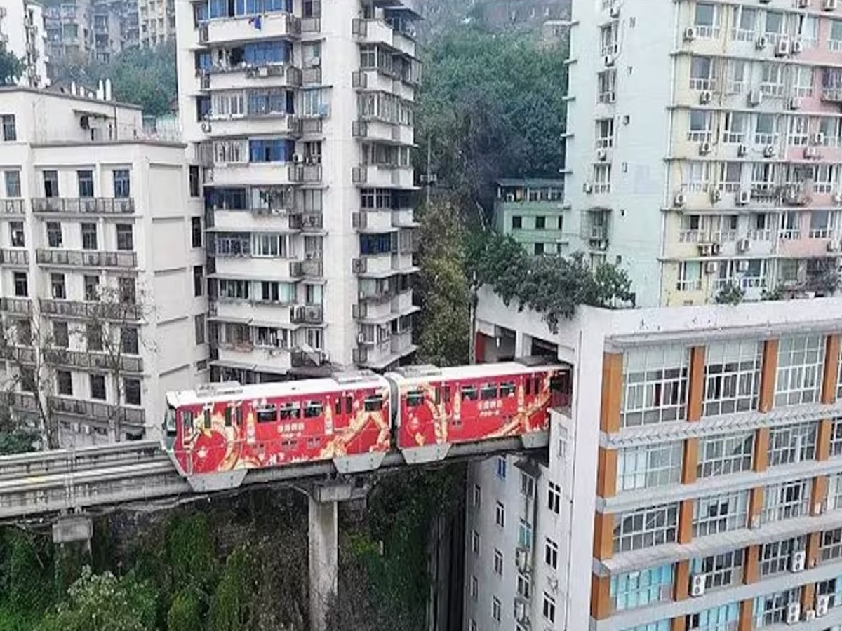 China worlds best train system Train runs through residential building ...