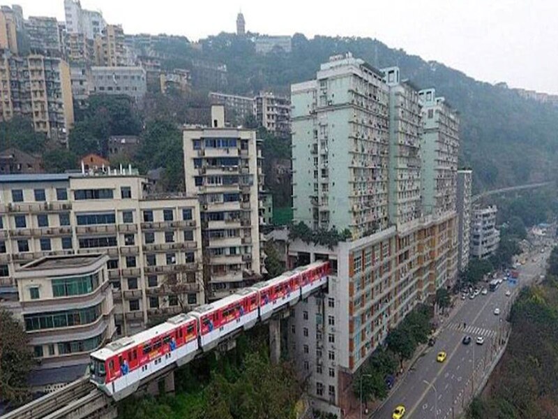 China worlds best train system Train runs through residential building ...