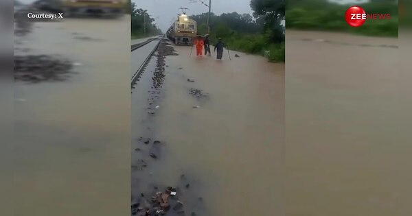 train tracks submerged in water due to heavy rains guided by railway ...