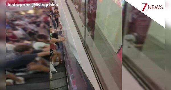 child head got stuck between wall and escalator then people helped ...